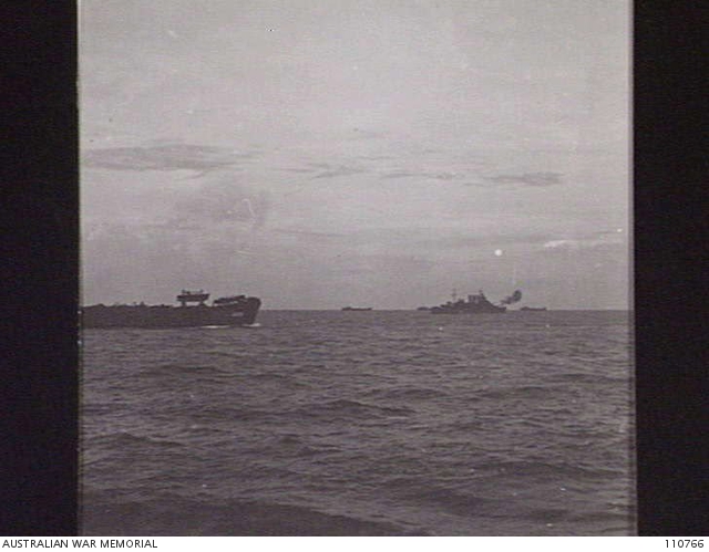 OFF BALIKPAPAN, BORNEO. 1 JULY 1945. THE RAN CRUISER HMAS SHROPSHIRE ...