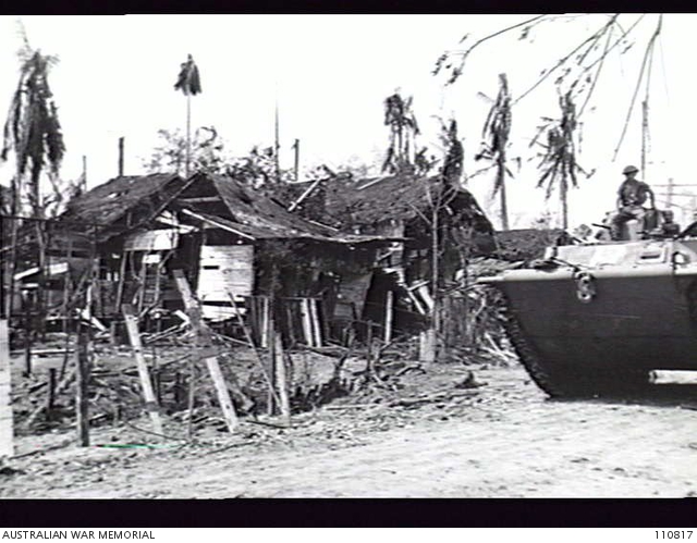 BALIKPAPAN, BORNEO. 1 JULY 1945. A LANDING VEHICLE TRACKED OF 1/21 ...
