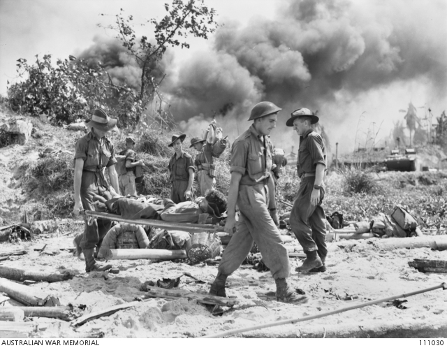 BALIKPAPAN, BORNEO, 1945-07-01. MEMBERS OF 2 BEACH GROUP SETTING UP A ...