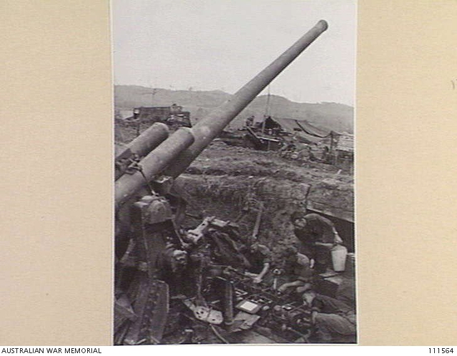 BALIKPAPAN AREA, BORNEO, 18 JULY 1945. THE MUZZLE OF A HEAVY JAPANESE ...