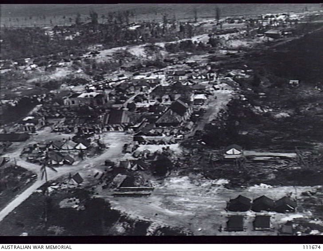 BALIKPAPAN, BORNEO, 19 JULY 1945. AERIAL VIEW OF A SECTION OF THE ...