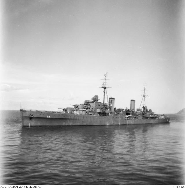 TAWITAWI ISLAND. 24 JUNE 1945. THE RAN CRUISER, HMAS HOBART, MOORED IN ...
