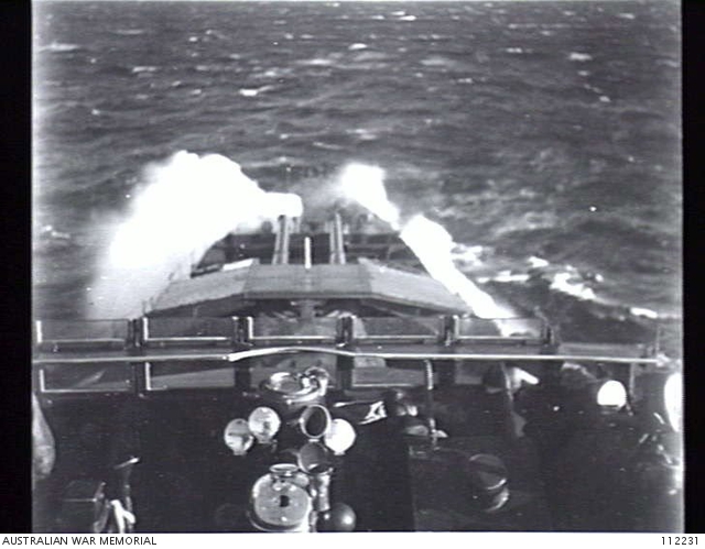 AT SEA. 17 JULY 1945. HEAVY SEAS BREAKING OVER THE BOWS OF THE RAN ...