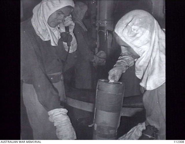 AT SEA. 1945-06-18. COOK O'CONNOR (1) AND LEADING COOK E. A. CROXSON (2 ...