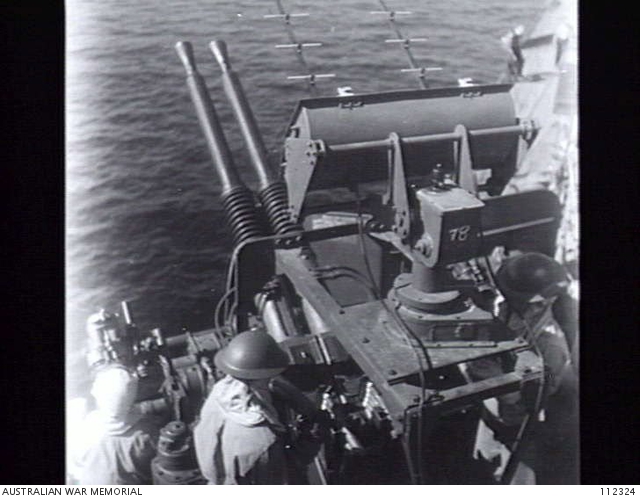 AT SEA. 1945-06-18. PETTY OFFICER LENNIS AND MEMBERS OF HIS GUN CREW ...