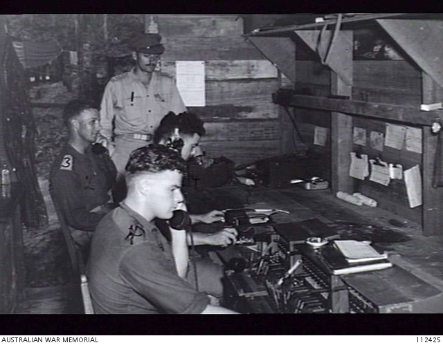 PERSONNEL WORKING IN THE SIGNALS OFFICE AT HQ 25 INFANTRY BRIGADE ...