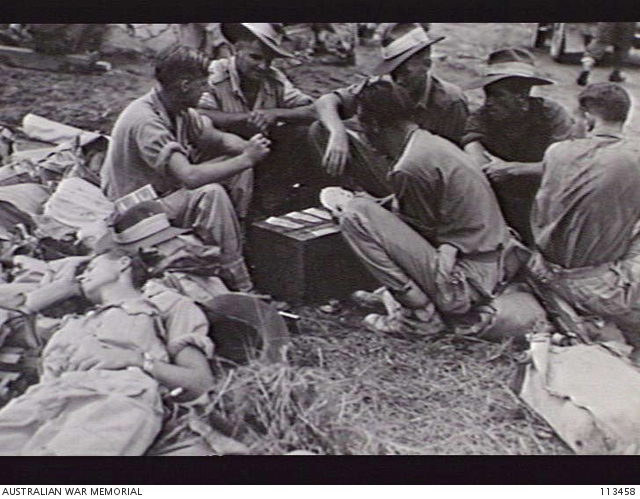 TARAKAN ISLAND. 1945-08-11. LONG SERVICE PERSONNEL PLAYING BRIDGE WHILE ...