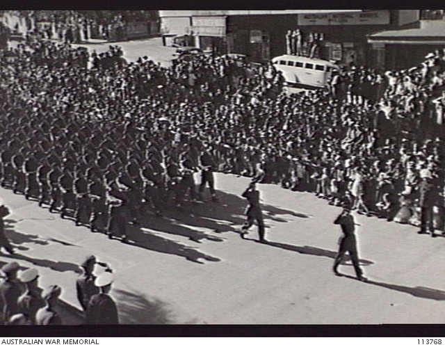 BRISBANE, QLD. 1945-08-16. APPROXIMATELY 10,000 MEN AND WOMEN OF THE ...