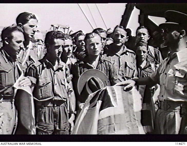 AT SEA, EN ROUTE TO SINGAPORE. 1945-08-30. MEMBERS OF 2 AUSTRALIAN POW ...