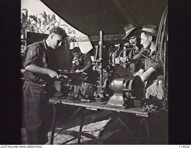 BALIKPAPAN, BORNEO. 1945-08-24. MEMBERS OF 2/47TH LIGHT AID DETACHMENT ...