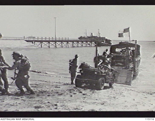 KOEPANG, TIMOR ISLAND. 1945-09-11. JEEPS OF TIMFORCE MOVING ASHORE FROM ...