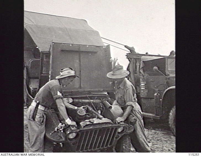 BALIKPAPAN, BORNEO. 1945-08-30. SERGEANT R. R. RILEY AND CAPTAIN J. D ...