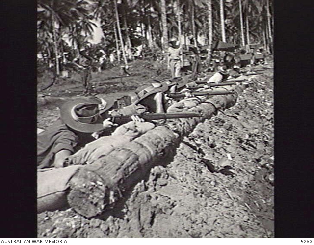 MOROTAI. 1945-08-30. MEMBERS OF HQ 1 CORPS FIRING THE FIVE ROUNDS RAPID ...