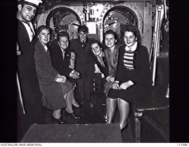 MELBOURNE, VIC. 1945-09-13. LADY VISITORS WITH ABLE SEAMAN JAMES RAE IN ...