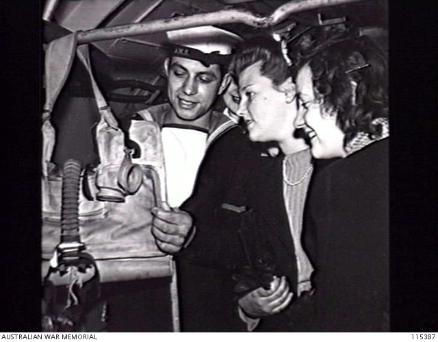 MELBOURNE, VIC. 1945-09-13. ABLE SEAMAN JAMES RAE EXPLAINING AN OXYGEN ...