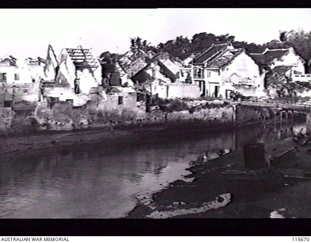 KOEPANG, TIMOR. 1945-09-12. THE CITY FORESHORES SHOWING BUILDINGS ...