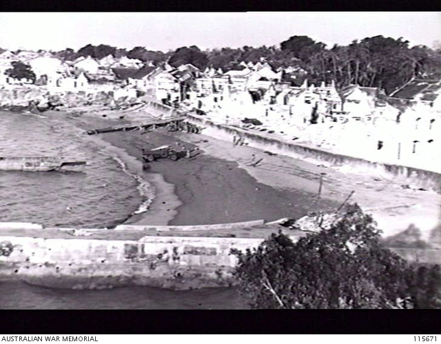 KOEPANG, TIMOR. 1945-09-12. THE CITY FORESHORES SHOWING BUILDINGS ...