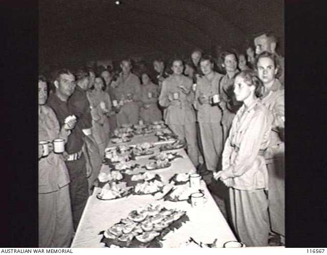 MOROTAI. 1945-09-02. GUESTS ENJOYING THE BUFFET SUPPER DURING THE ...