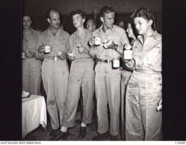 MOROTAI. 1945-09-02. GUESTS ENJOYING THE BUFFET SUPPER DURING THE ...