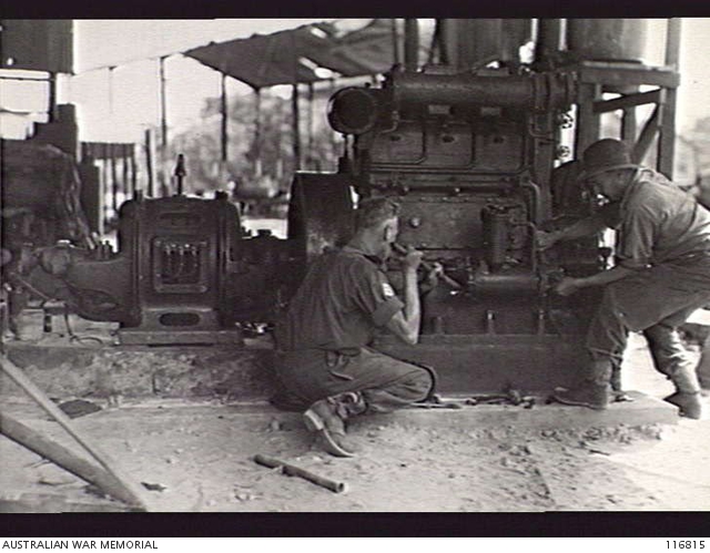 BALIKPAPAN, BORNEO. 1945-09-07. STAFF SERGEANT K. T. STARR (1) AND ...