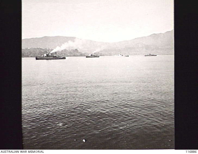 MANADO, CELEBES. 1945-09-13. RAN CORVETTES STANDING OFF SHORE WHILE ...
