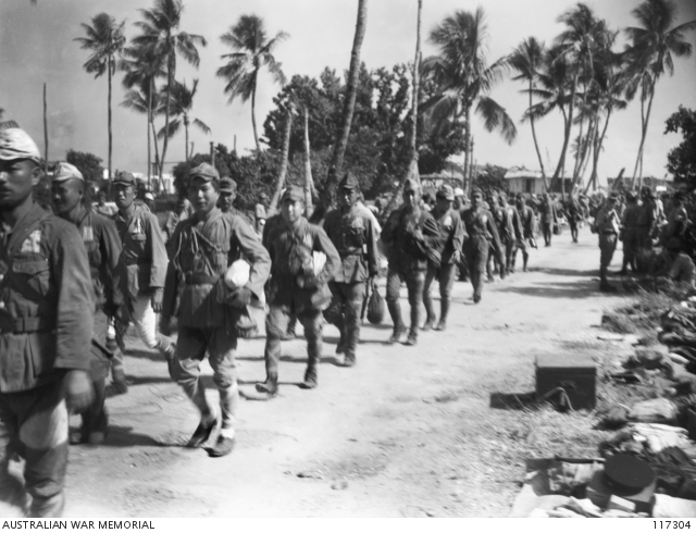 NAURU ISLAND, 1945-09-16. JAPANESE PRISONERS OF WAR MOVING TO THE WHARF ...
