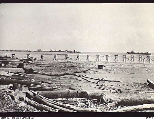 TARAKAN ISLAND. 1945-10-03. THE PIPELINE JETTY OF 2 FIELD COMPANY WHICH ...