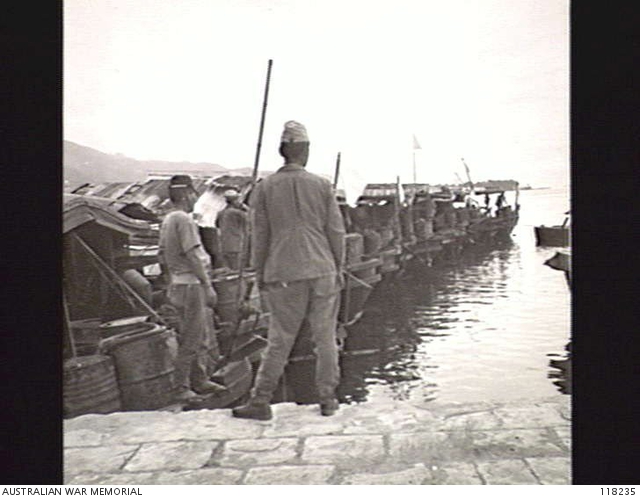 AMBON ISLAND. 1945-09-22. JAPANESE BARGES TAKEN OVER BY THE RAN MOORED ...