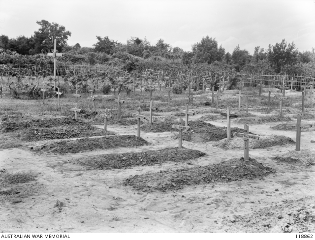Nakom Paton, Thailand. 19 September 1945. Graves marked with wooden ...