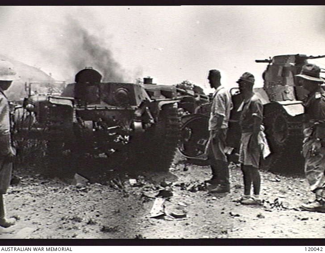 Taibessi, Timor. 1945-09-30. Japanese tanks burn in the whole sale ...