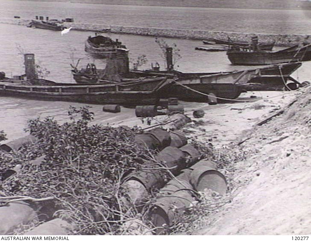TENAU, DUTCH TIMOR 1945-11-06. DERELICT JAPANESE BARGES ON TENAU ISLAND ...