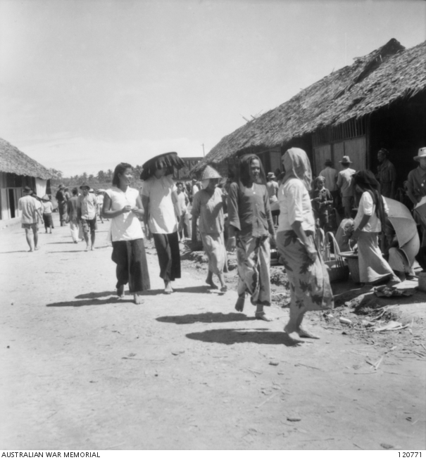 PAPAR, NORTH BORNEO 1945-09-27. THE NEWLY REVIVED NATIVE BAZAAR AT ...