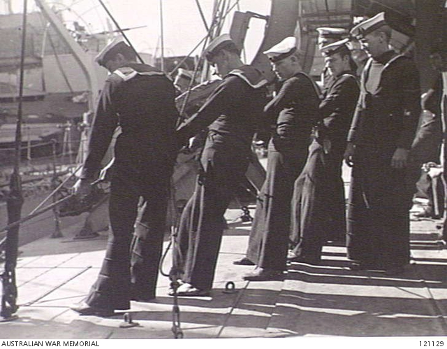 SYDNEY HARBOUR, NSW. 1945-06-28. HMAS NEPAL CASTING OFF IN SYDNEY ...