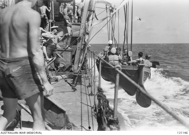 1945-07-08. A LIFEBOAT COMING ABOARD HMAS NEPAL AFTER RESCUING A ...