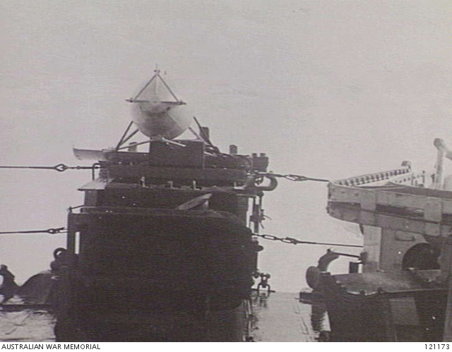 AT SEA OFF JAPAN, 1945-08-09. PARAVANES AND DEPTH CHARGES ON HMAS NIZAM ...