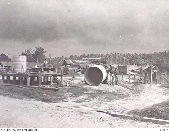 PAPAR, NORTH WEST BORNEO 1945-10-06. 2/28TH BATTALION MEN WATCHING ...