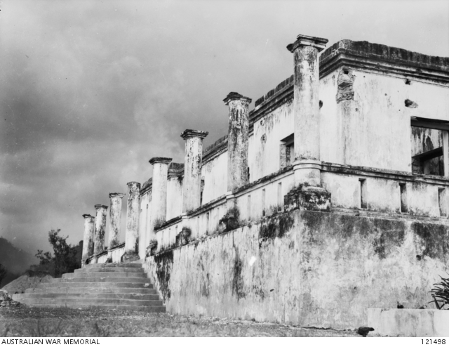 SAME, PORTUGUESE TIMOR 1945-12-16. ONE OF THE BUILDINGS WRECKED BY RAAF ...