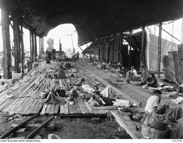 SANDAKAN, NORTH BORNEO 1945-10-26. BADLY EMACIATED CHINESE, MALAY AND ...