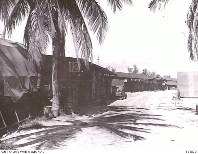 LABUAN ISLAND, NORTH BORNEO 1945-12-11. THE ROAD INTO NO. 3 SUB DEPOT ...