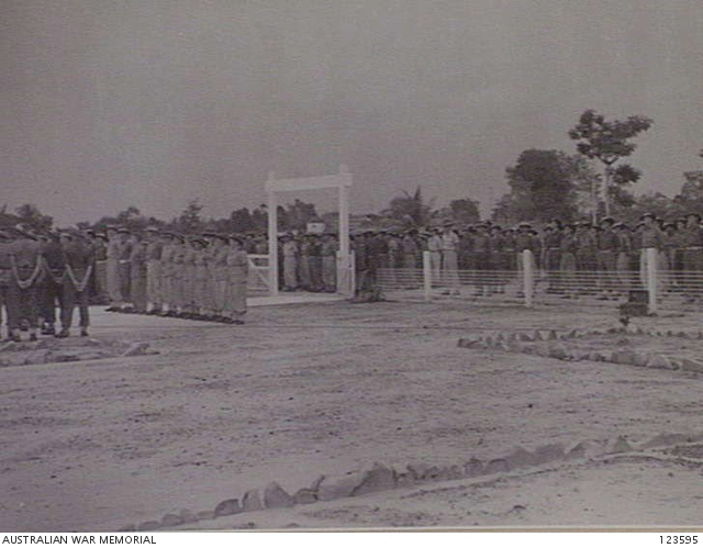LABUAN ISLAND, NORTH WEST BORNEO 1945-12-28. ASSEMBLED TROOPS LISTEN TO ...