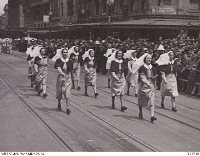 MELBOURNE, VIC 1945-11-29. A GROUP OF NURSES MARCHING TOWARDS THE ...