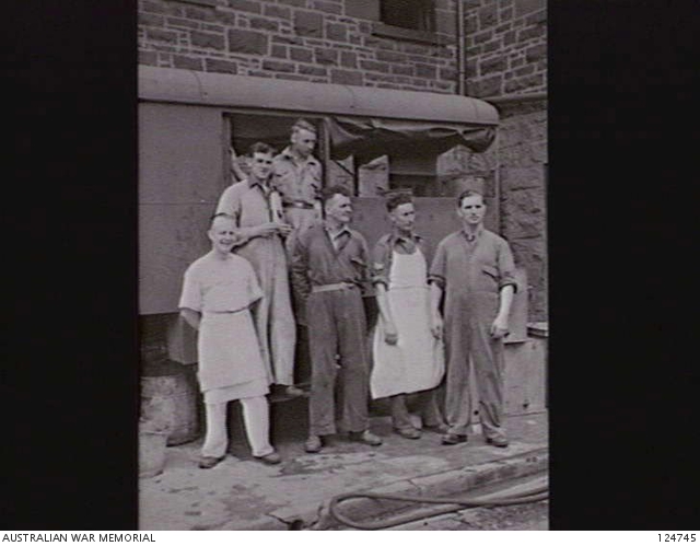 MELBOURNE, VIC 1945-12-07. KITCHEN STAFF (NOT IDENTIFIED) BESIDE A ...