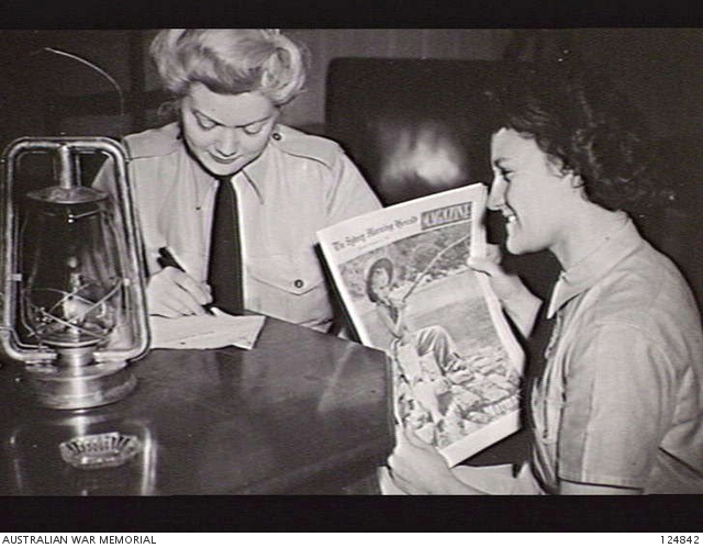 SYDNEY, NSW 1945-12-11. SERGEANT MCGINTY (WRITING) AND CORPORAL SMITH ...