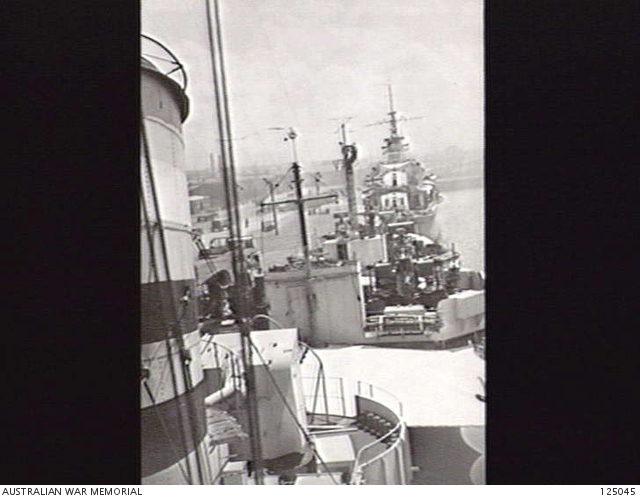 HMS TUSCAN AS SEEN AFT FROM THE BRIDGE OF HMS ARMADA. BOTH SHIPS ARE ...