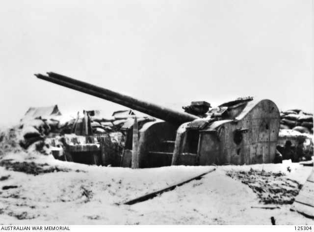 BALIKPAPAN, BORNEO. 1946-01. ONE OF THE THREE 100MM TWIN BARREL NAVAL ANTI-AIRCRAFT GUNS ON ...