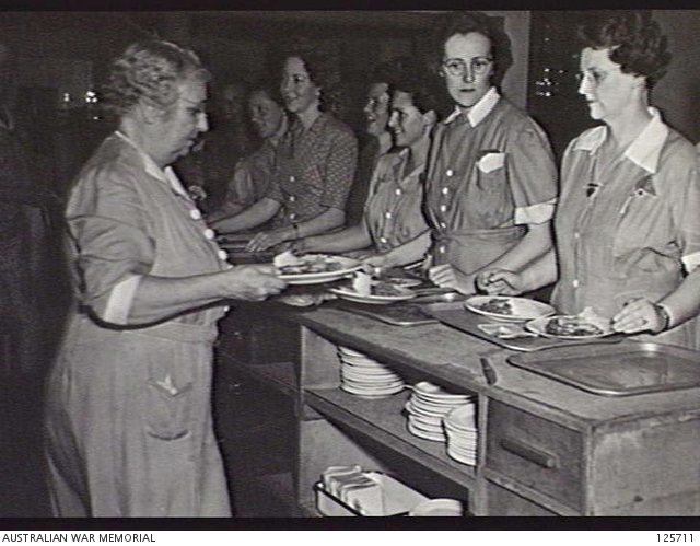 SYDNEY, NSW. 1946-02-05. WOMEN VOLUNTEER WAITRESSES LINED UP WAITING ...