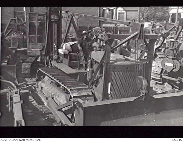 LEICHHARDT, NSW. 1946-03-14. NX154433 SAPPER J. BRYDER DRIVING A D7 ...