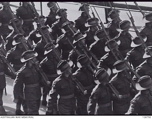 MELBOURNE, VIC. 1946-04-18. ARMY PERSONNEL PASSING THE SALUTING BASE AT ...