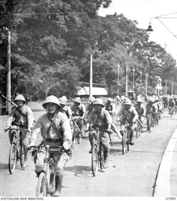 BATAVIA, JAVA. 1942-03-10. JAPANESE BICYCLE UNIT PERSONNEL MOVE ALONG A ...