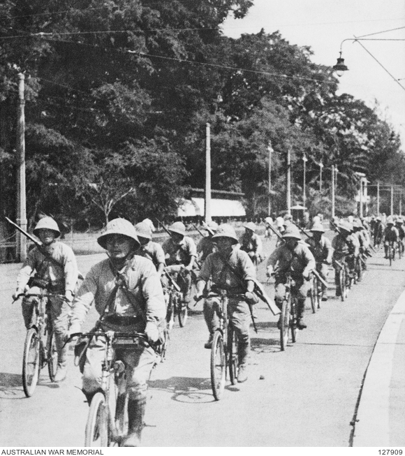 BATAVIA, JAVA. 1942-03-10. JAPANESE BICYCLE UNIT PERSONNEL MOVE ALONG A ...